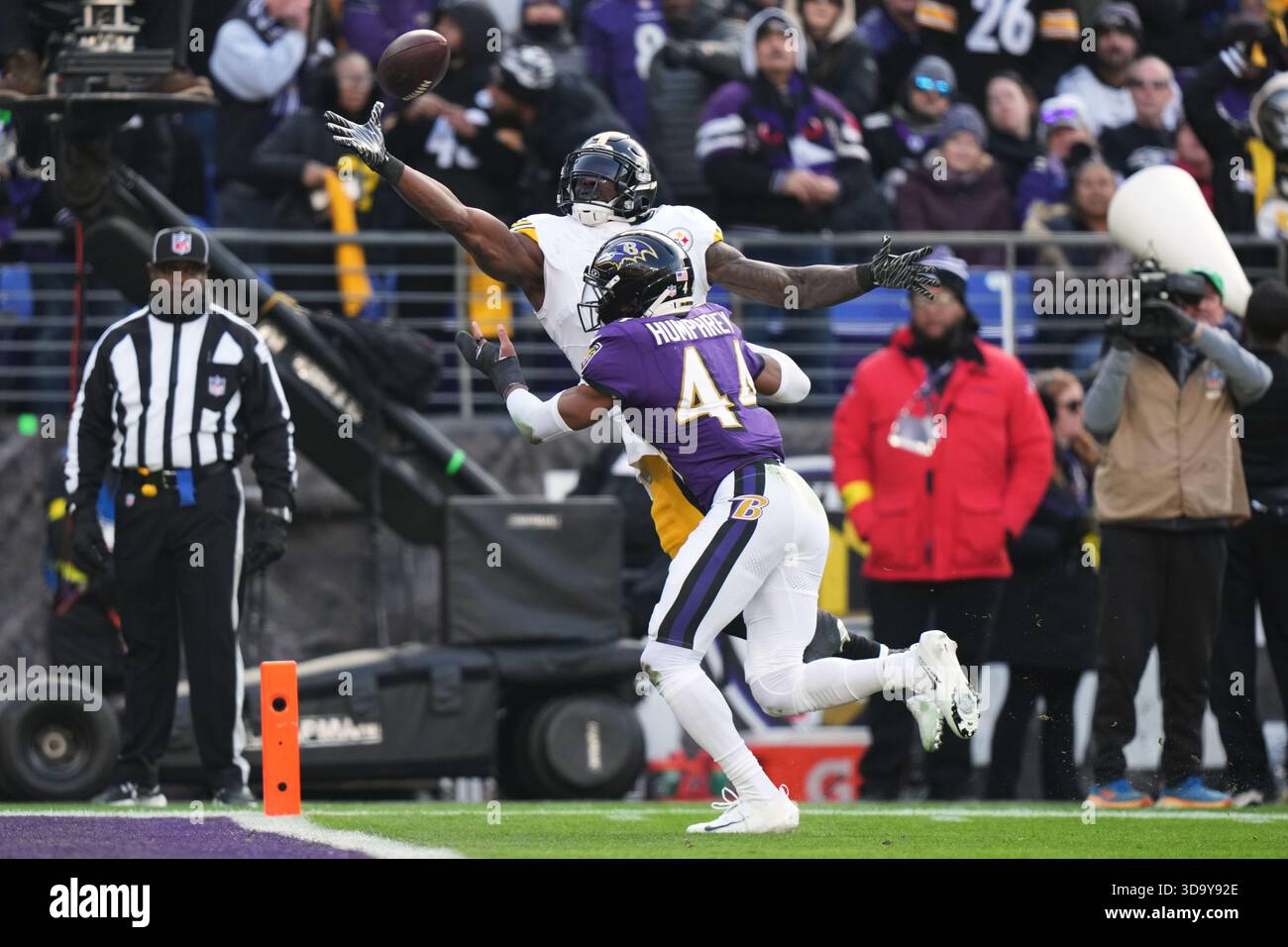 Baltimore Ravens cornerback Marlon Humphrey (44) breaks up a pass ...