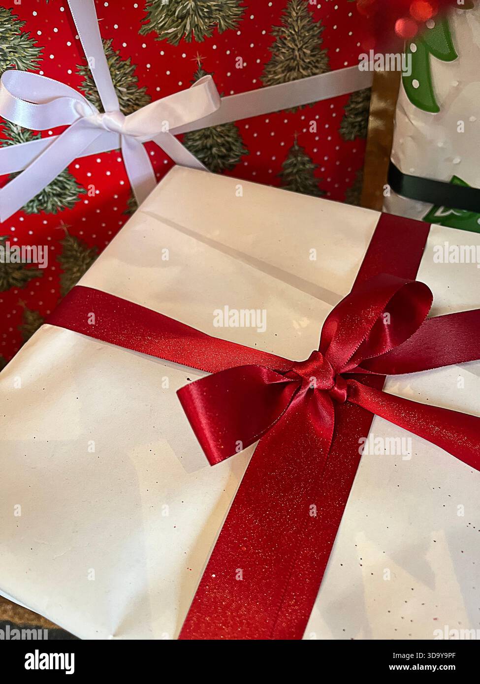 Christmas background featuring a white present with a red bow ready for ...