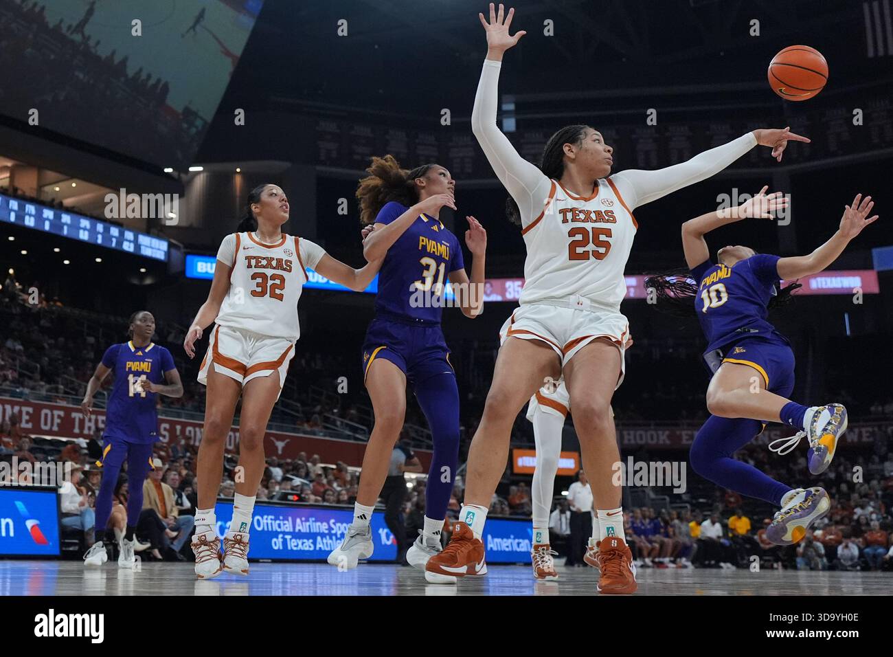 Prairie View A&M guard Crystal Schultz (10) is blocked by Texas forward ...