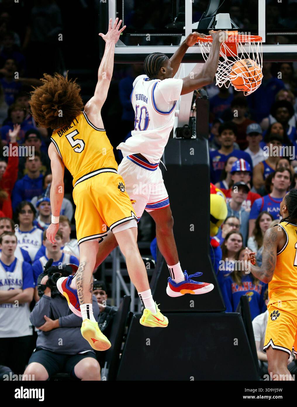 Kansas forward Flory Bidunga (40) dunks as Missouri guard T.O. Barrett ...