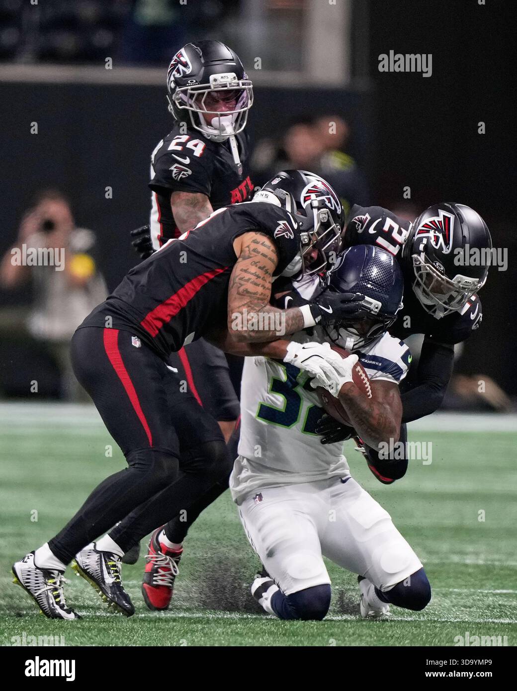 Seattle Seahawks running back Velus Jones Jr. is tackled by Atlanta ...