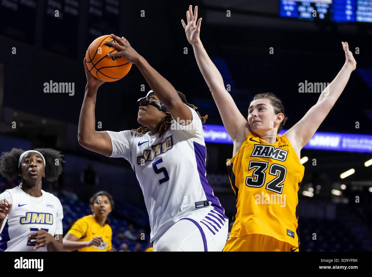 James Madison forward Ashanti Barnes (5) goes up to shoot past VCU ...
