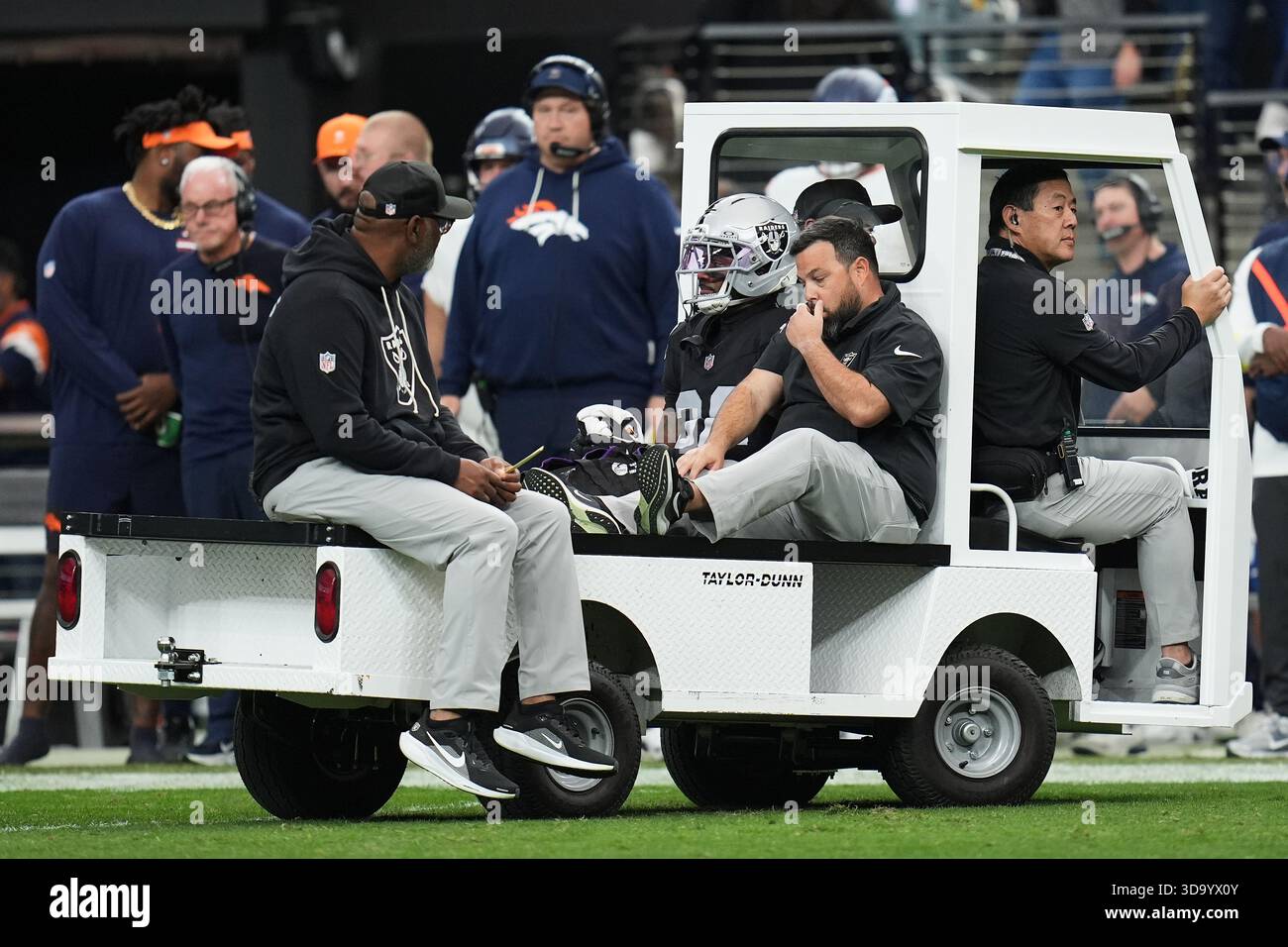 Las Vegas Raiders cornerback Kyu Blu Kelly is carted off the field ...