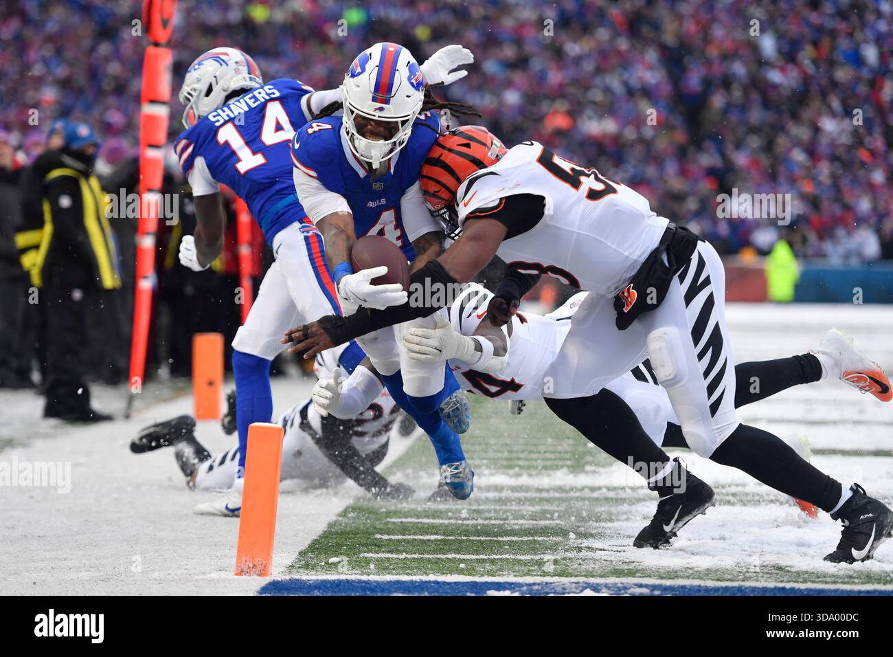 Buffalo Bills running back James Cook III, center, dives for the pylon ...