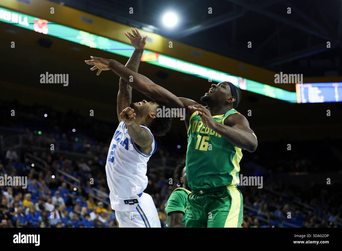 UCLA guard Donovan Dent (2) draws a foul against Oregon center Ege ...