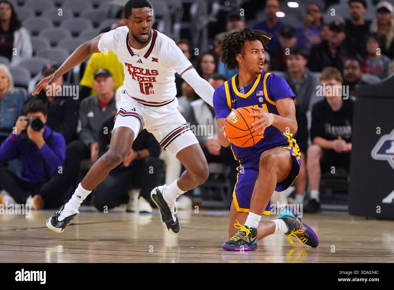LSU guard Dedan Thomas Jr., right, looks to pass against Texas Tech ...