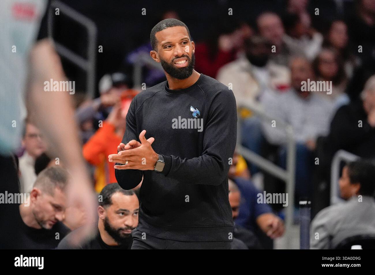 Charlotte Hornets head coach Charles Lee looks on during the first half ...