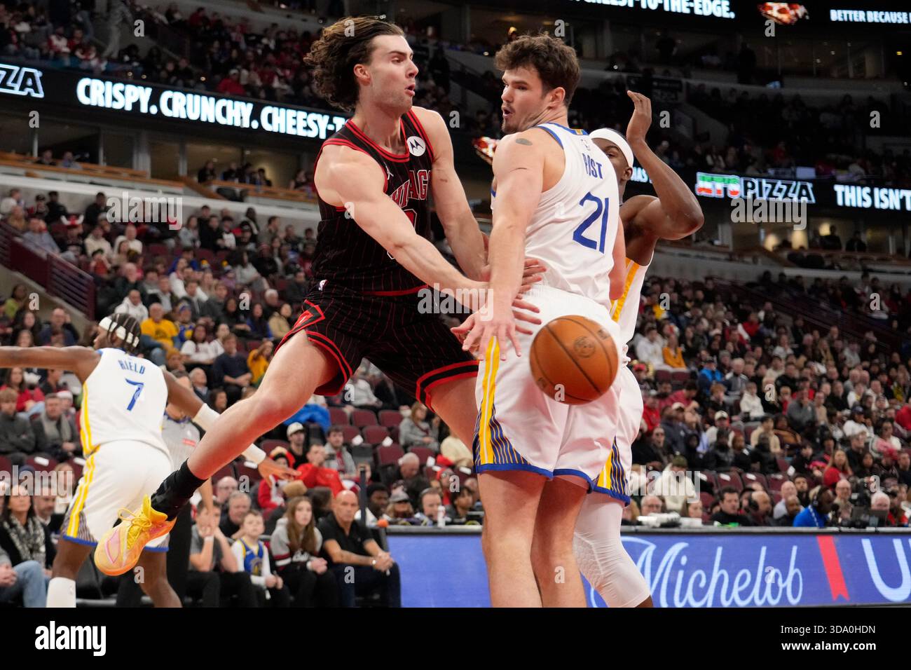 Chicago Bulls guard Josh Giddey, left, passes the ball around Golden ...