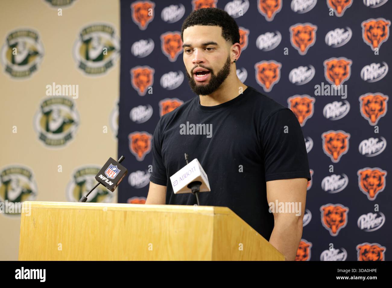 Chicago Bears quarterback Caleb Williams (18) speaks in a press ...