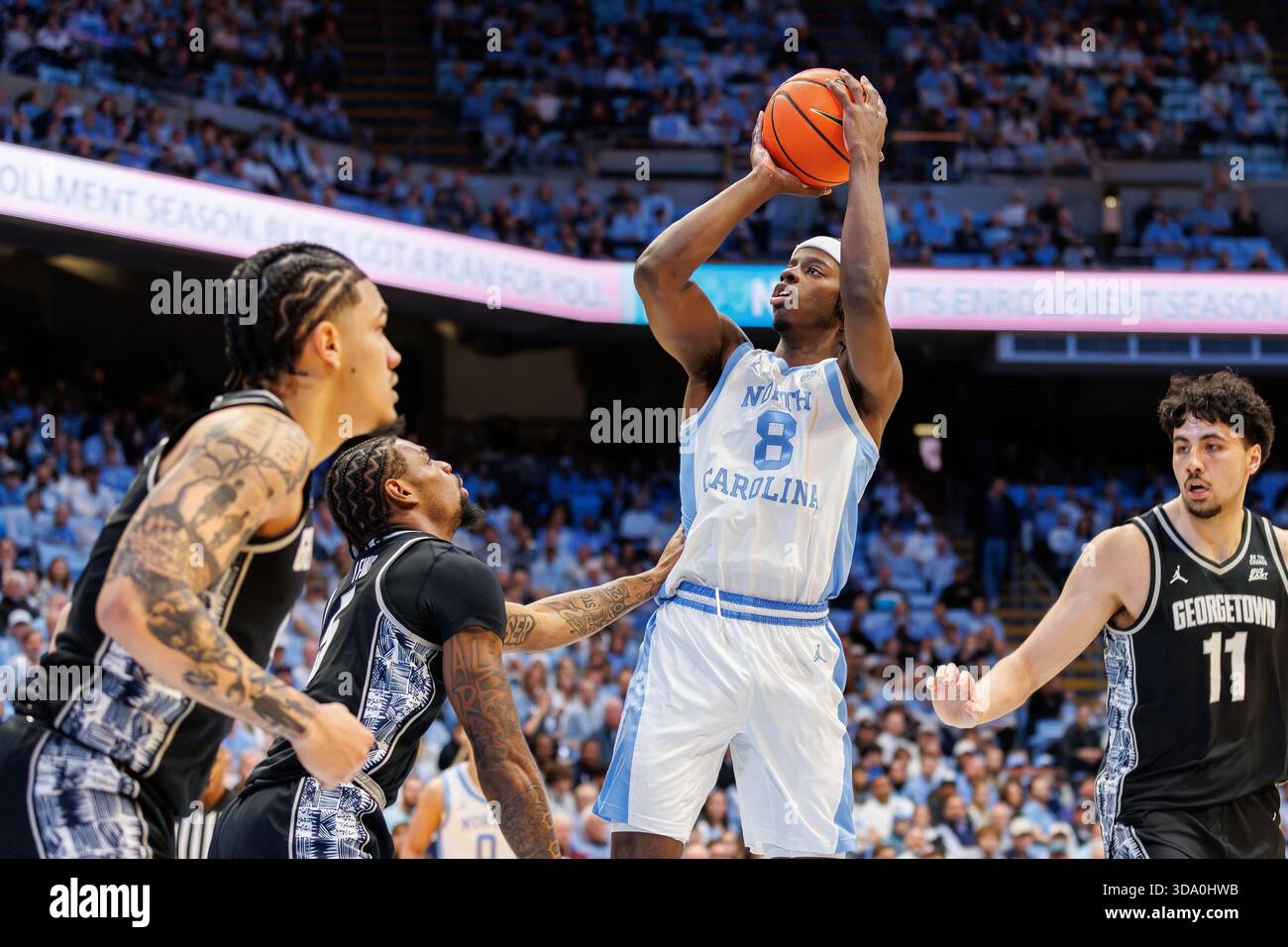 North Carolina's Caleb Wilson (8) attempts to shoot over Georgetown's ...
