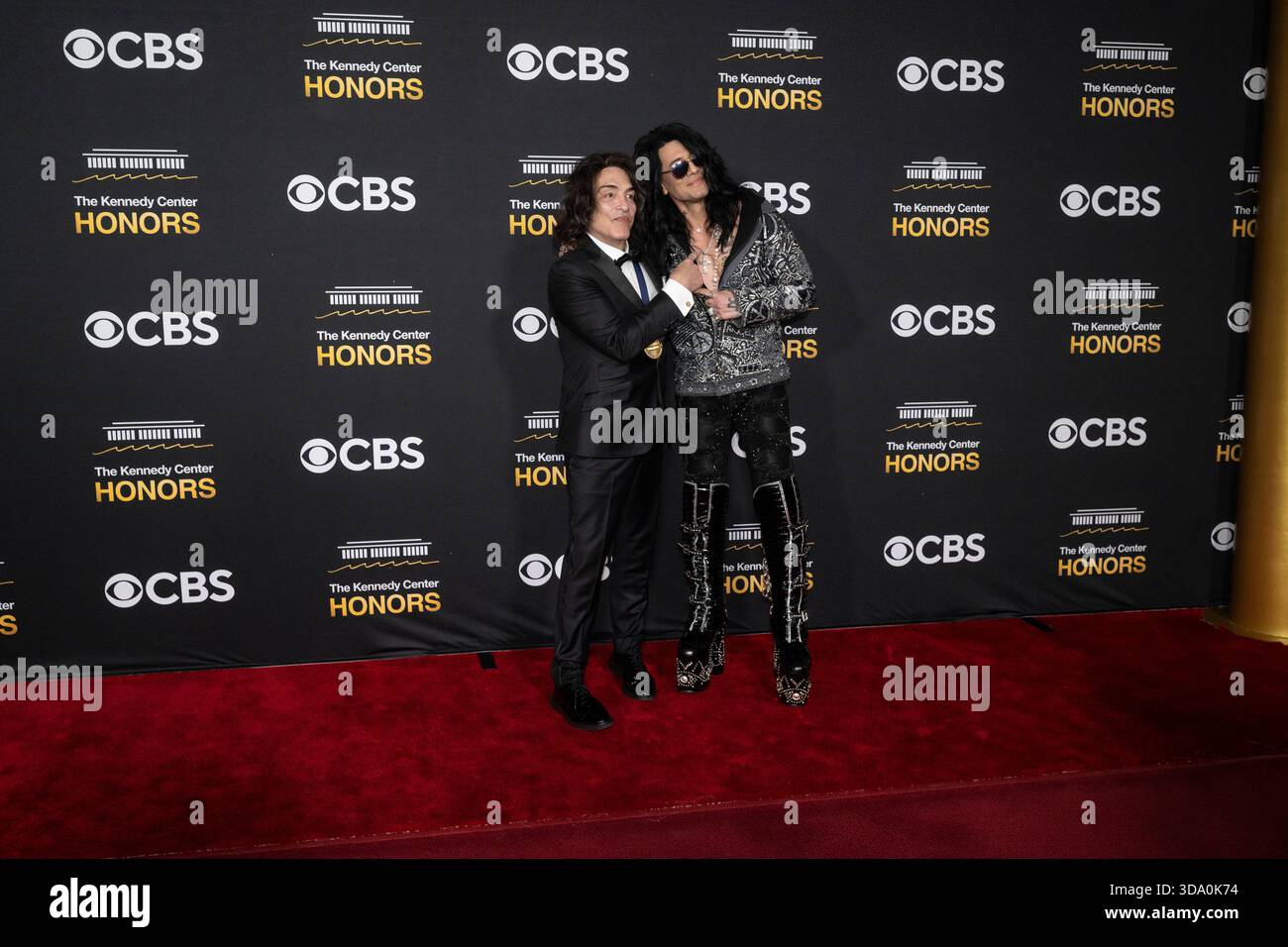 Magician Criss Angel and KISS member Paul Stanley pose for a picture at ...