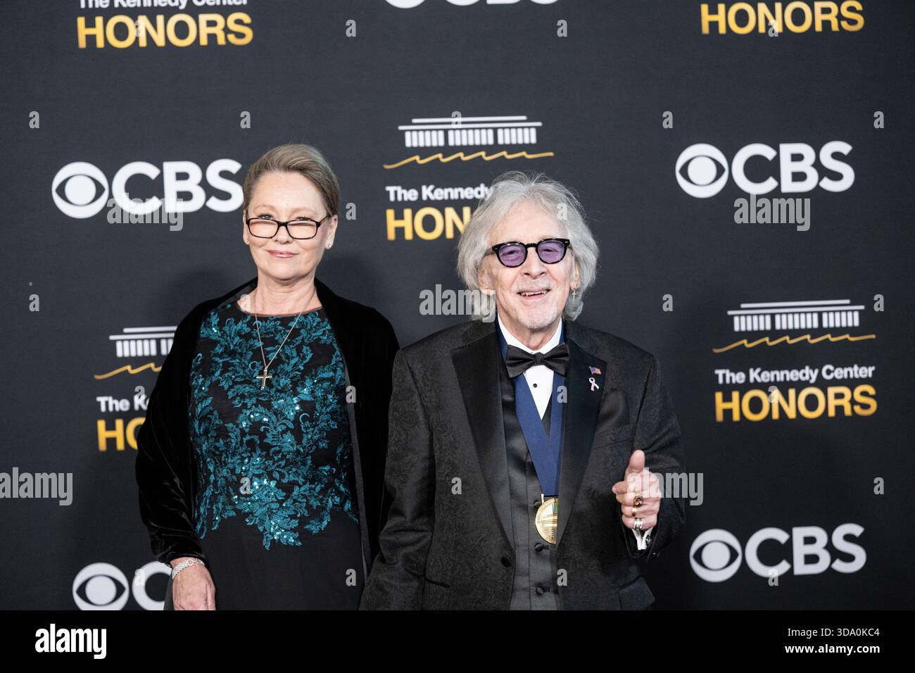 KISS member Peter Criss and wife Gigi Criss attend a Red Carpet event ...
