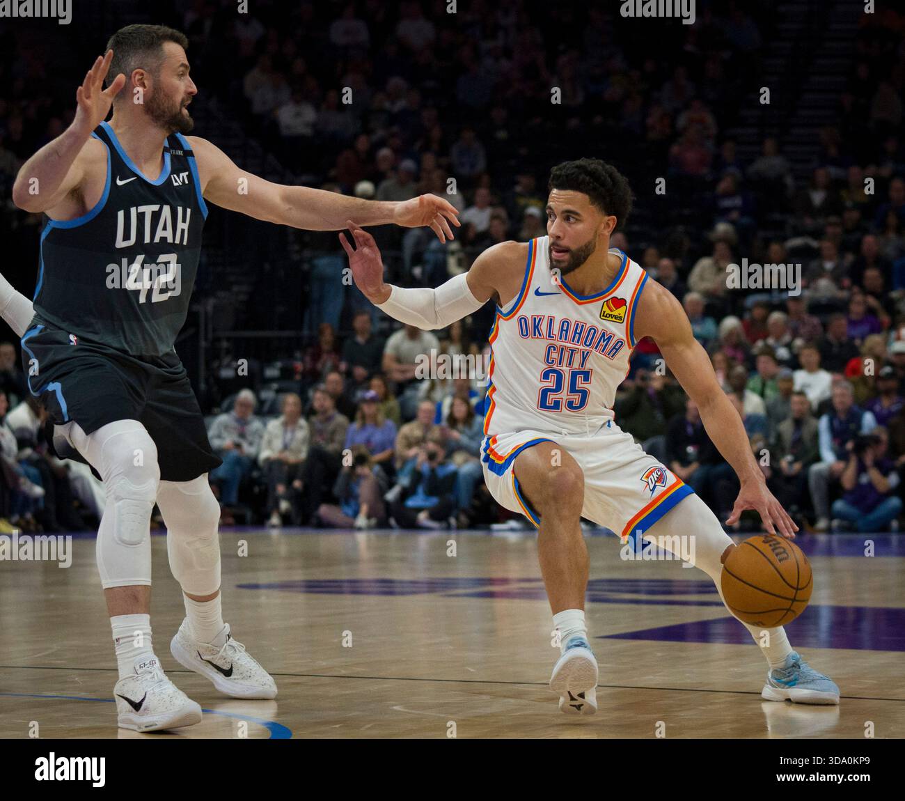 Oklahoma City Thunder guard Ajay Mitchell (25) dribbles as Utah Jazz ...
