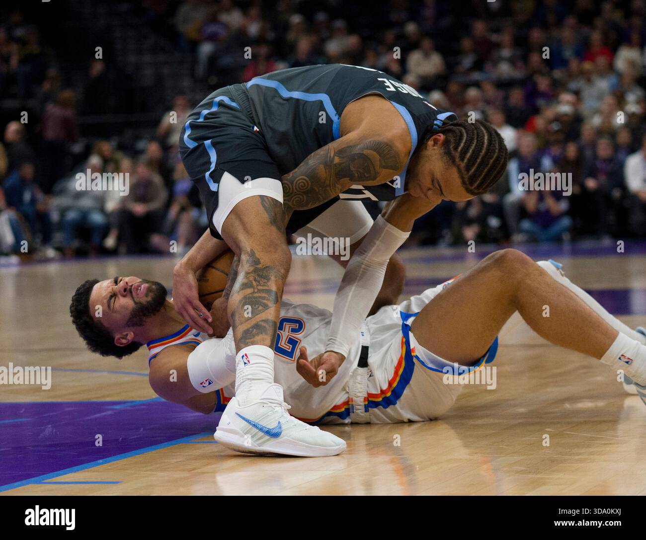 Utah Jazz guard Keyonte George, top, and Oklahoma City Thunder guard ...