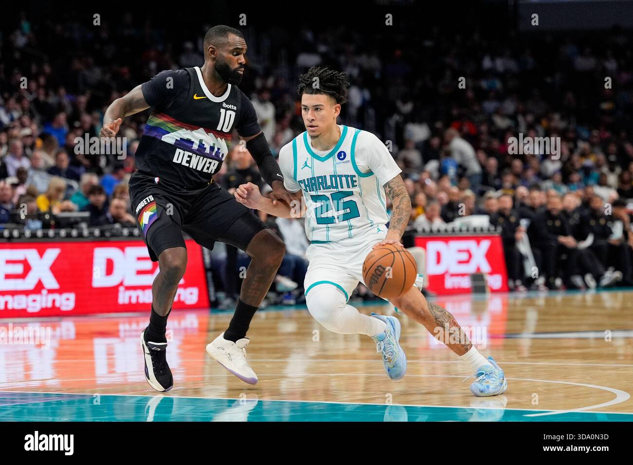 Charlotte Hornets guard KJ Simpson (25) goes to the basket against ...