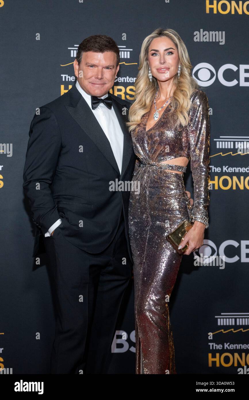 Bret Baier, left, and Amy Baier arrive on the red carpet for the 48th ...