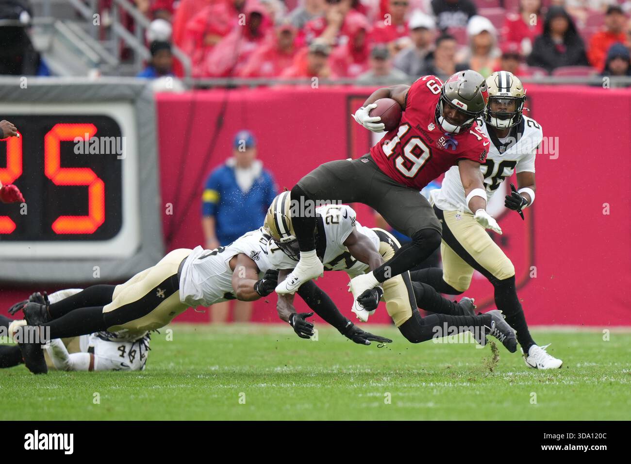 Tampa Bay Buccaneers wide receiver Kameron Johnson (19) leaps etween ...