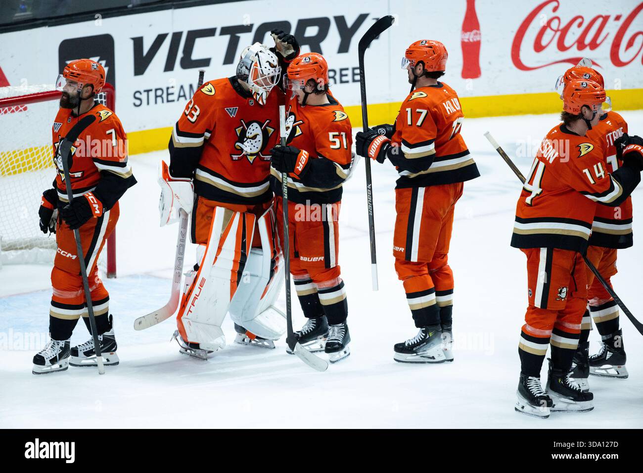 The Anaheim Ducks embrace after defeating the Chicago Blackhawks after ...