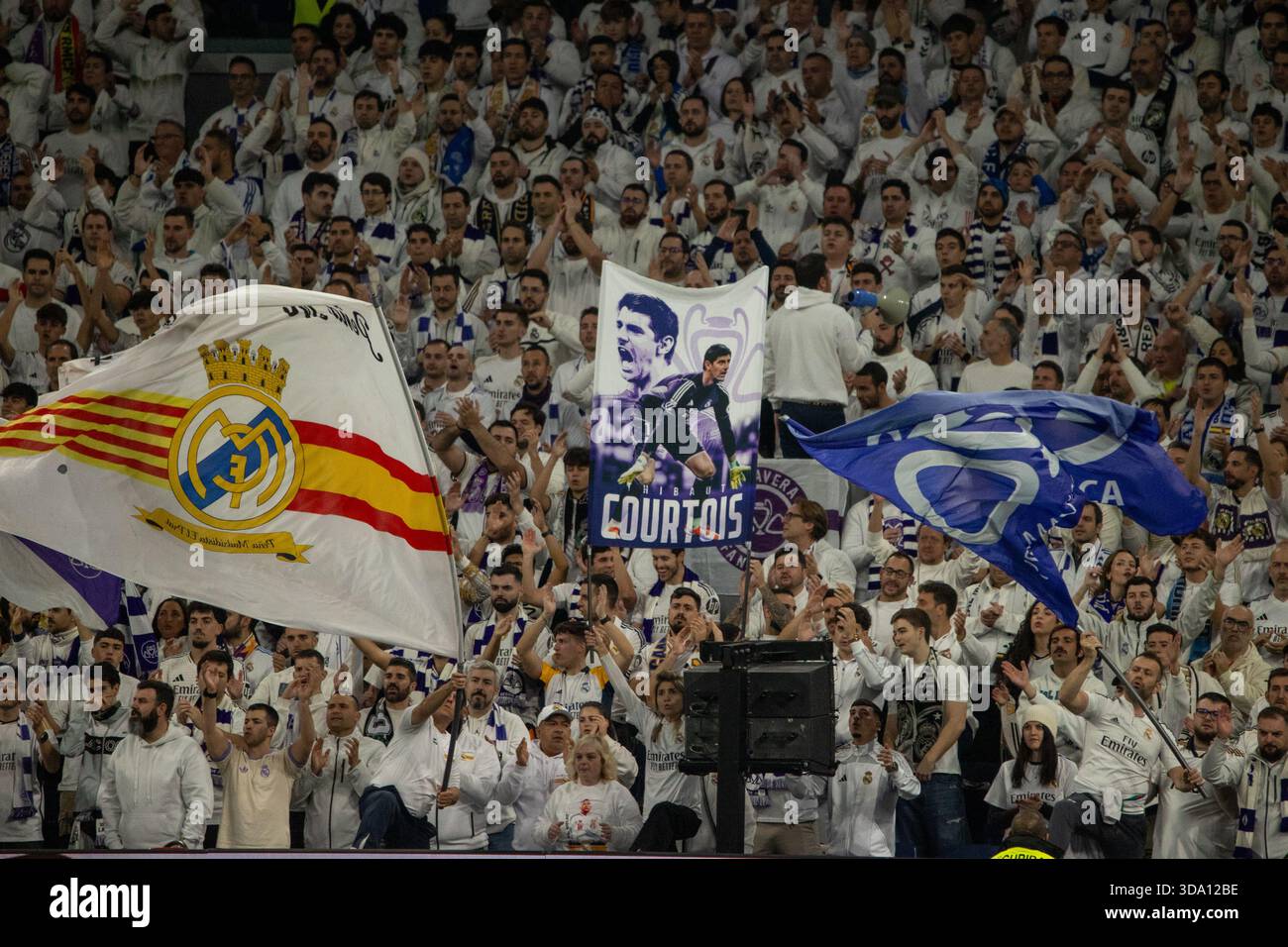 Real Madrid fans raise a banner with Thibaut Courtois's name on it ...