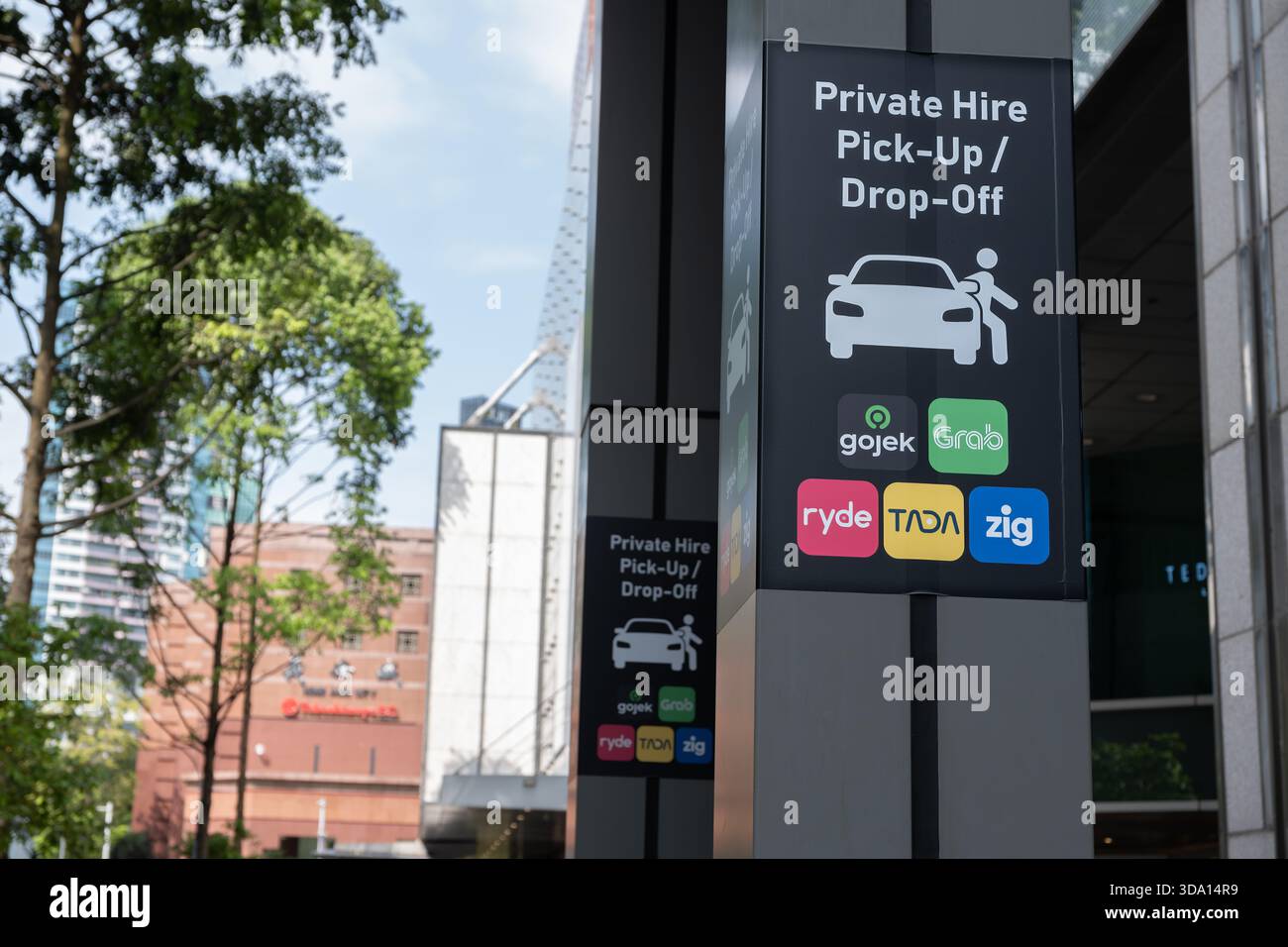 A clear sign indicating private hire pick-up and drop-off zones in ...