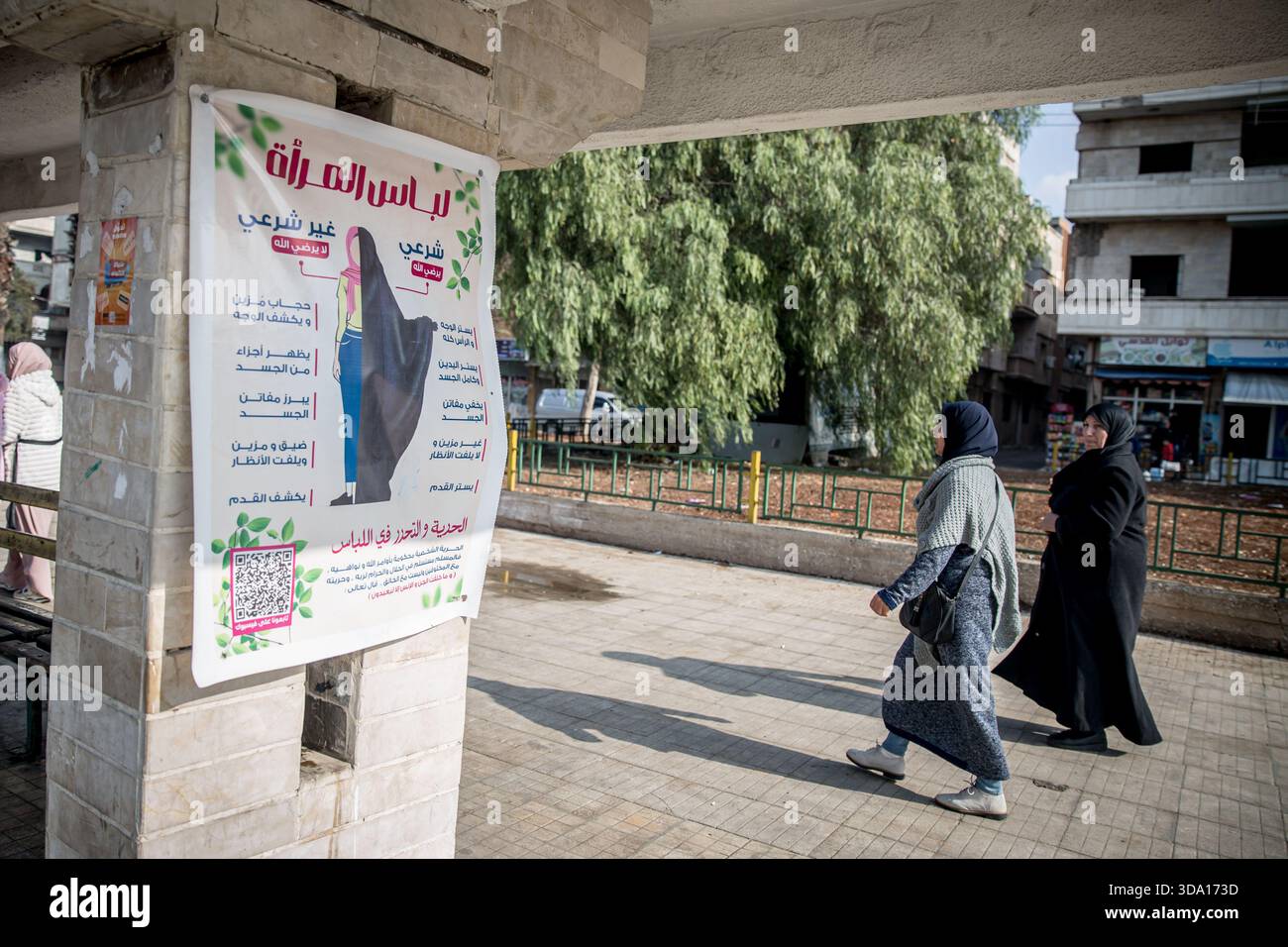 A poster in Homs encourages women to wear more clothes. Celebrations ...