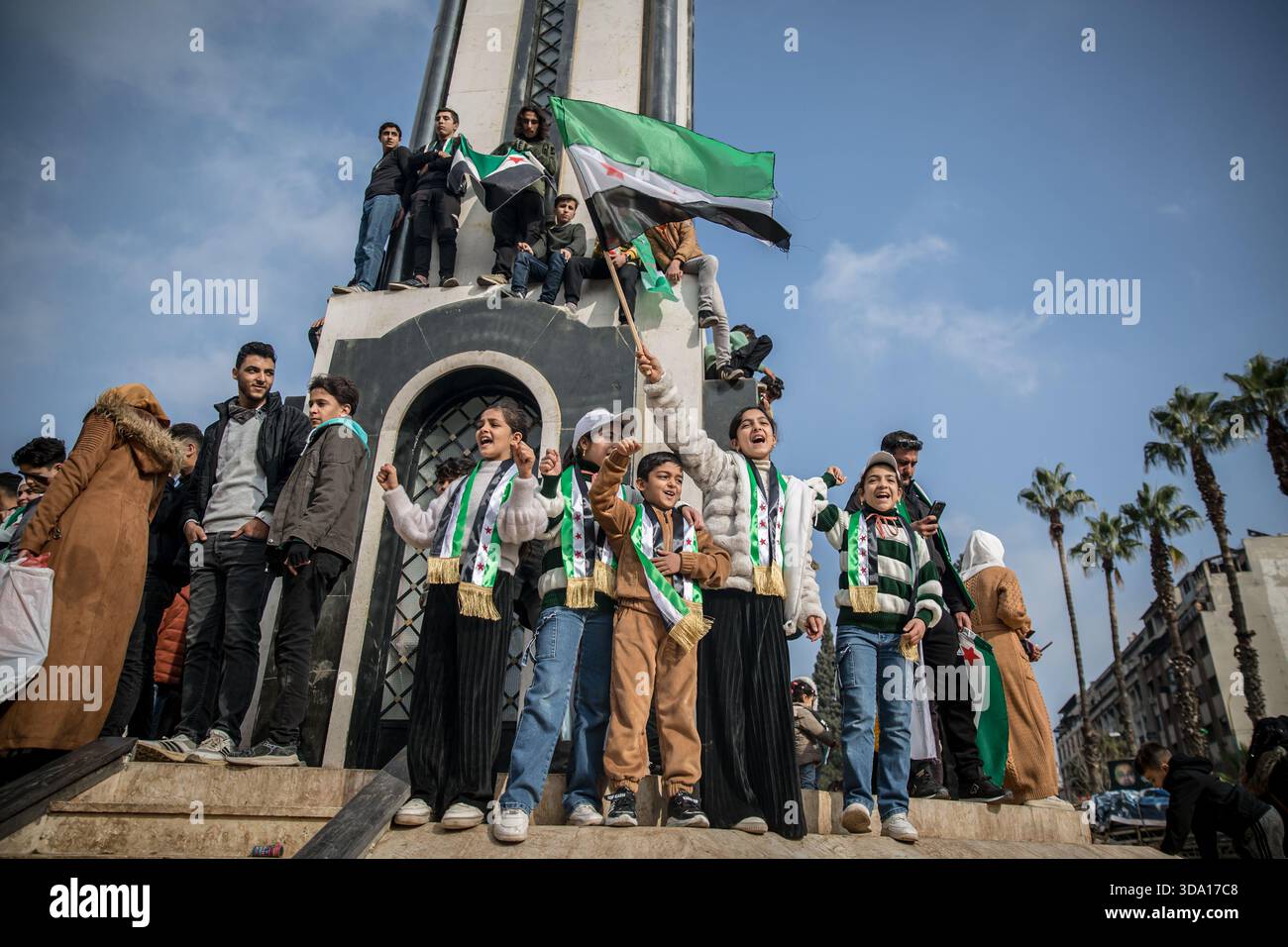 Children wave Syrian flags in central Homs. Celebrations were held in Homs on the eve of the ...