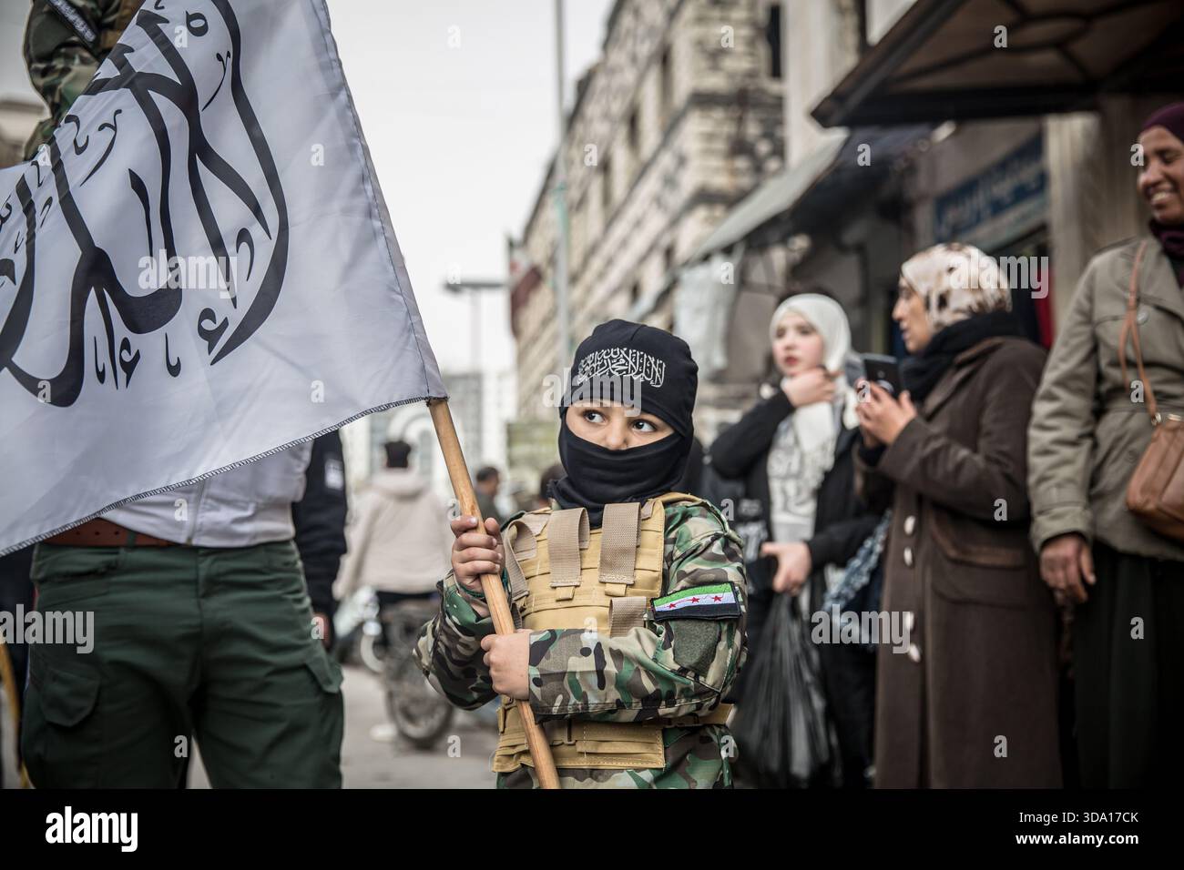 A Syrian child dressed up as a rebel fighter. Celebrations were held in ...