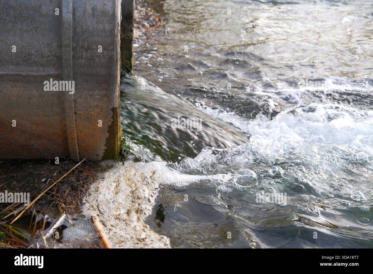 Concrete outfall pipe, discharging water or treated effluent into river ...
