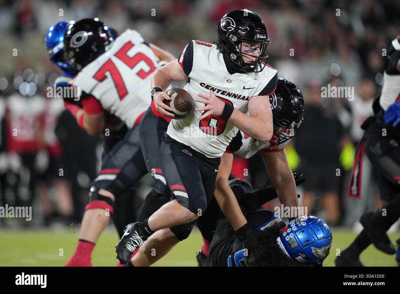 Corona Centennial Huskies quarterback Dominick Catalano (8) carries the ...
