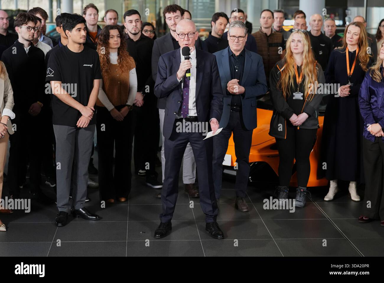 British Prime Minister Keir Starmer, back center right, listens to Work and Pensions Secretary ...