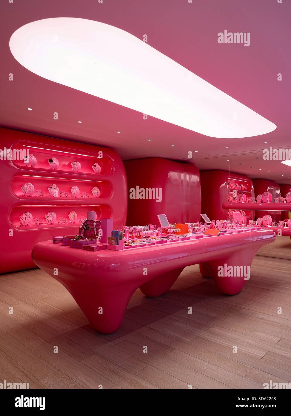 Modern retail space features a bright pink design and unique displays ...