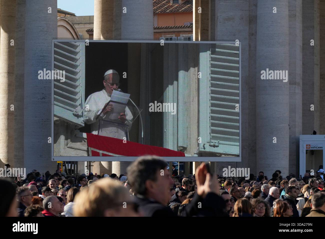 Pope Leo XIV appears on a giant monitor as he addresses the faithful ...