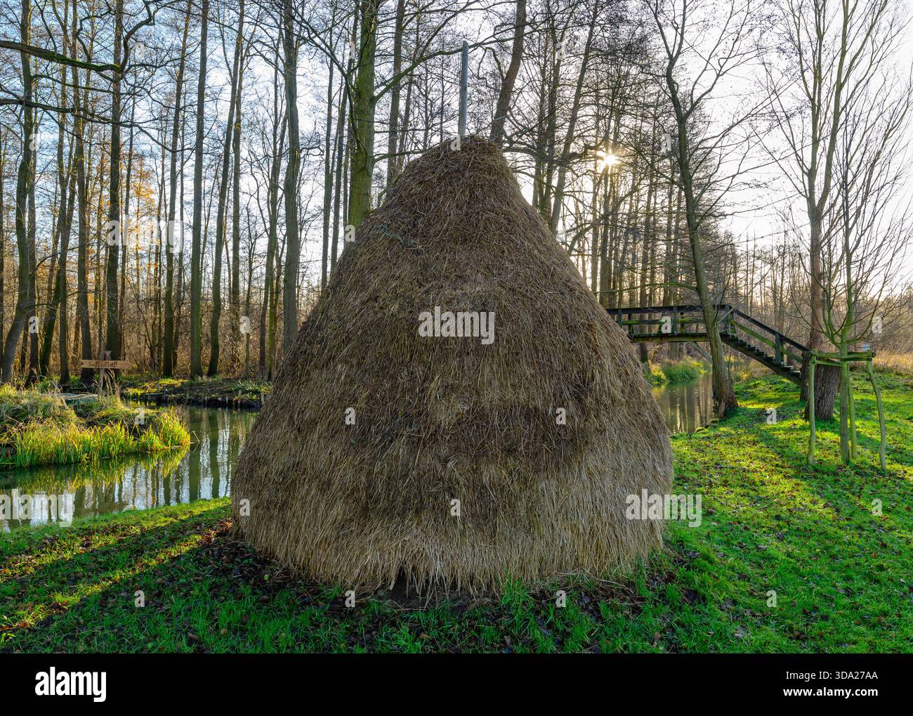 08 December 2025, Brandenburg, Neu Zauche: A haystack stands by a ...