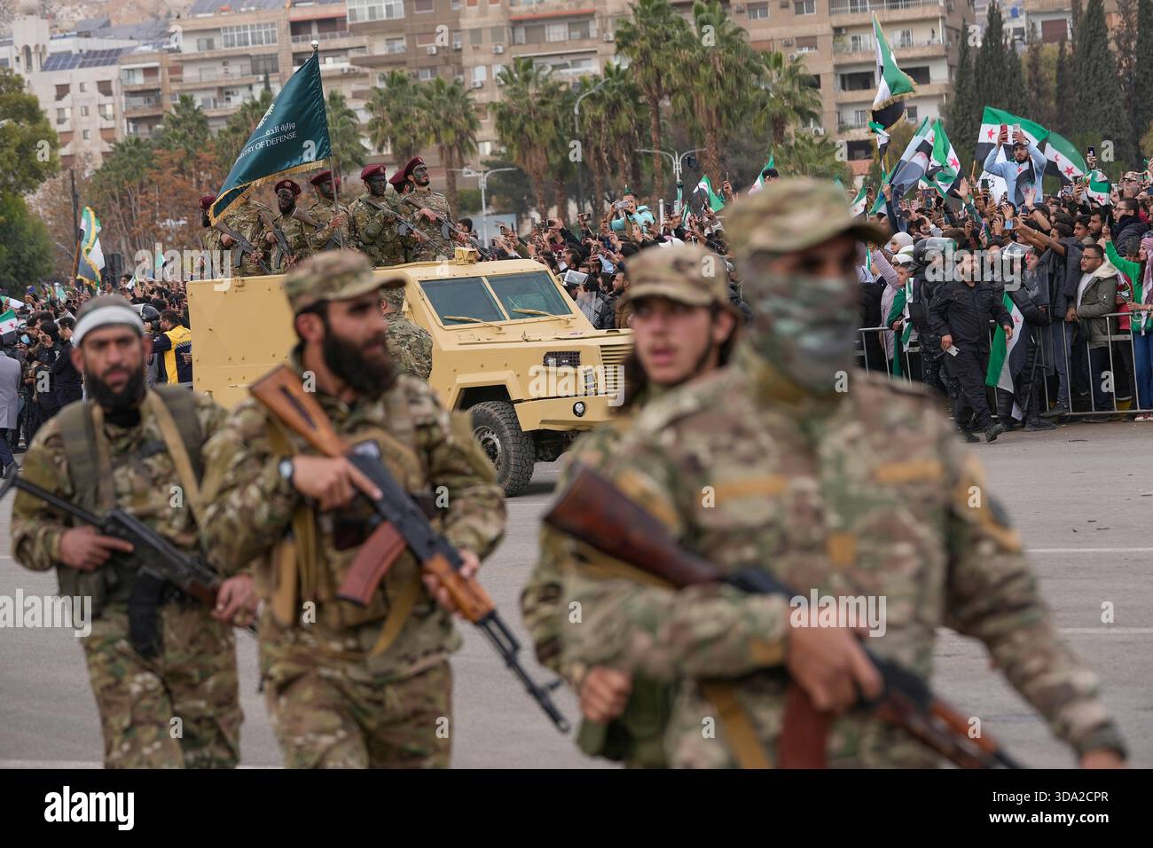 New Syrian army soldiers march during a parade marking the first ...