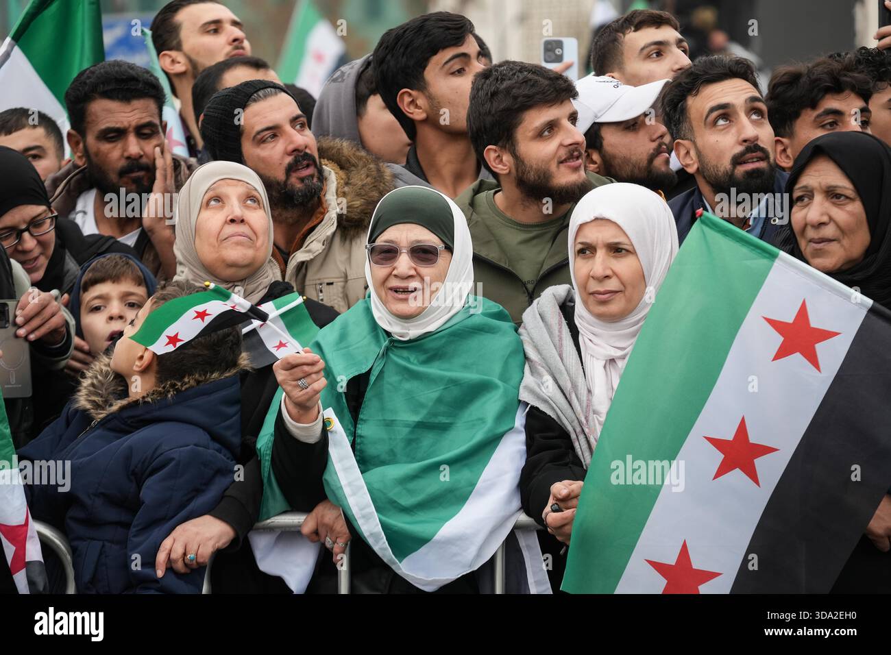 08 December 2024, Syria, Damascus: Syrians celebrate in Umayyad Square ...