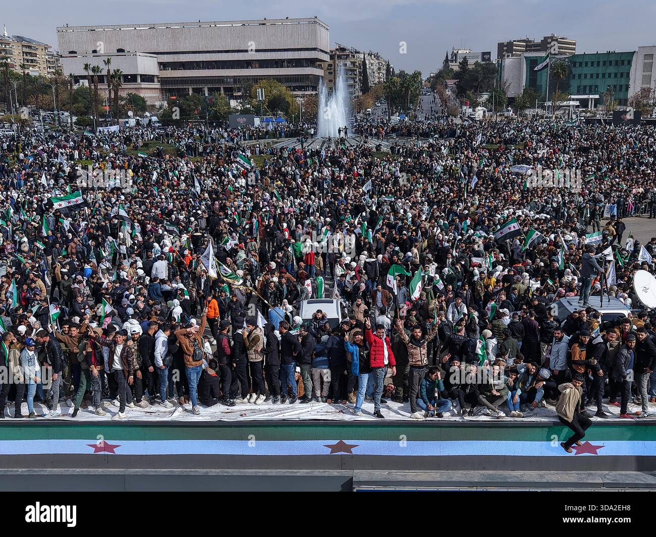 08 December 2024, Syria, Damascus: Syrians celebrate in Umayyad Square ...