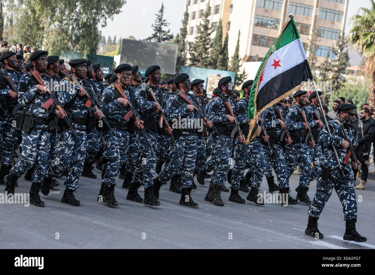 08 December 2025, Syria, Damascus: Officers participate in the military ...