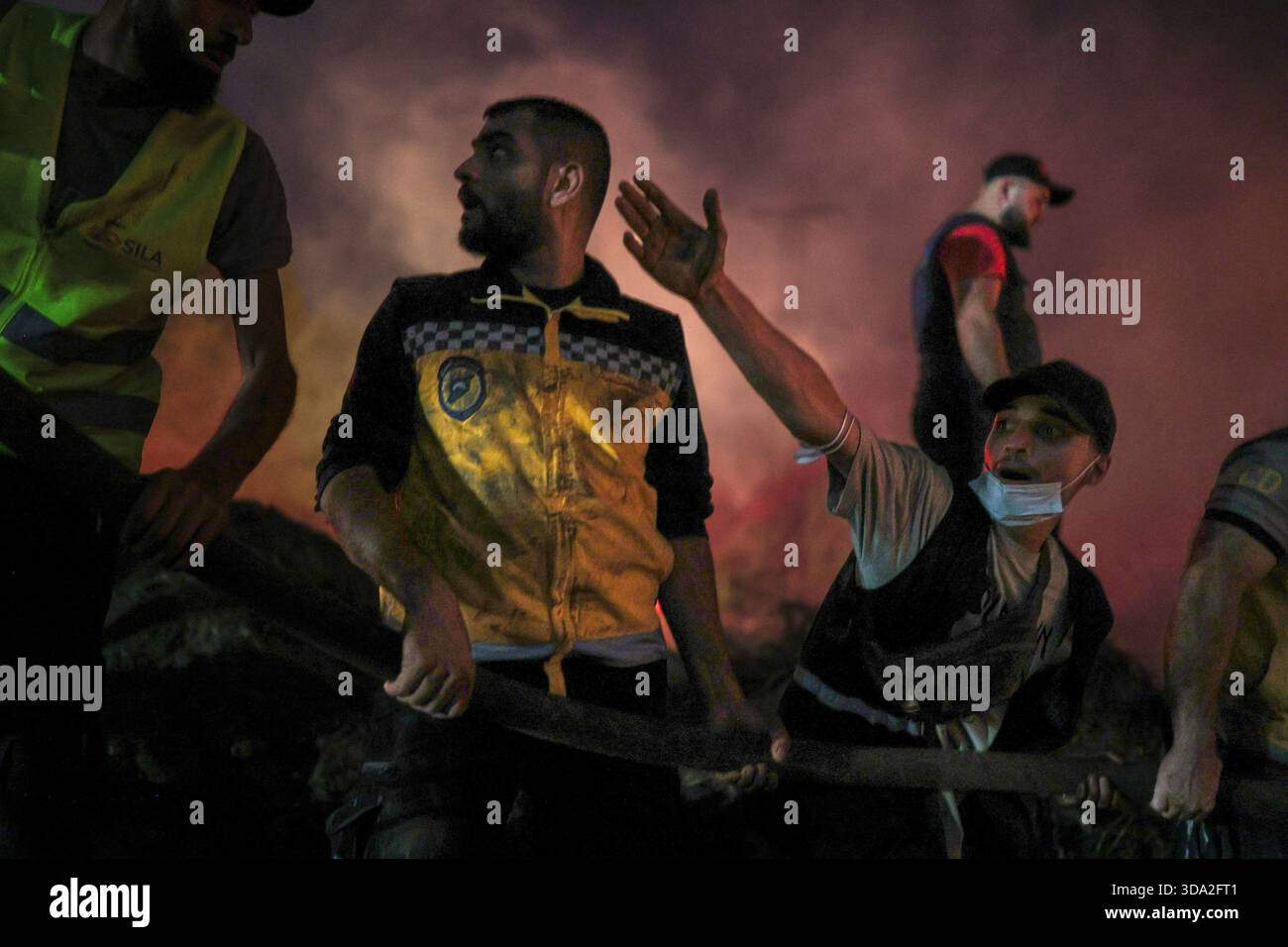 Syrian Civil Defense teams and volunteers battle wildfire flames for ...