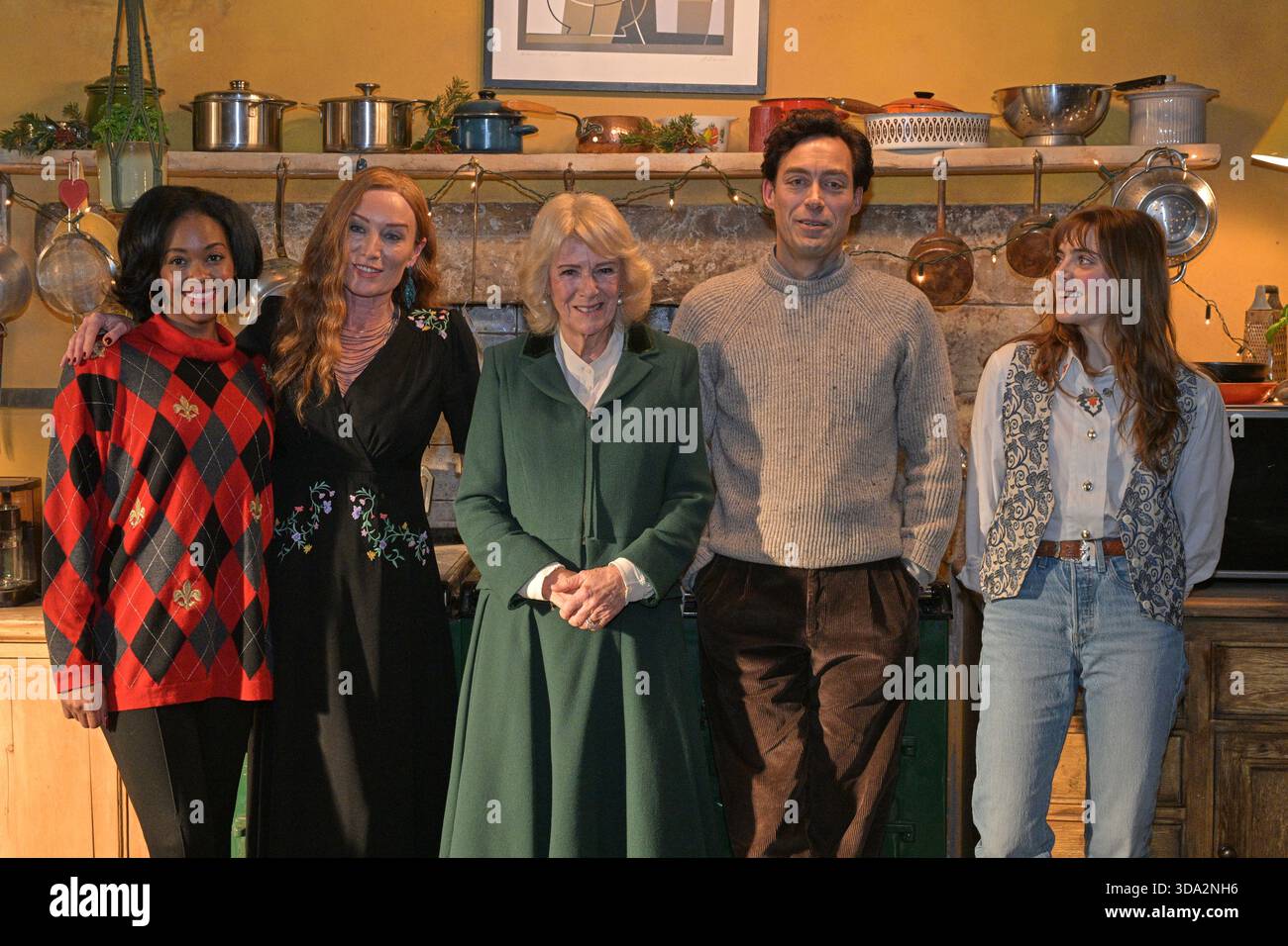 Britain's Queen Camilla, poses with actors Nafessa Williams, left ...