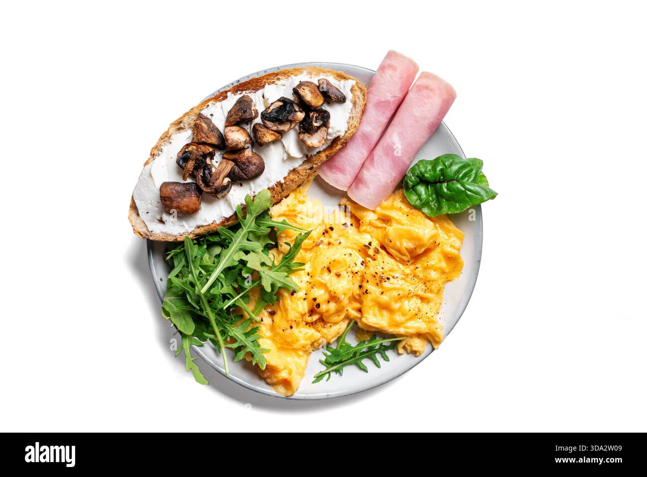 Healthy balanced breakfast plate. Scrambled eggs, ham, sandwich with ...