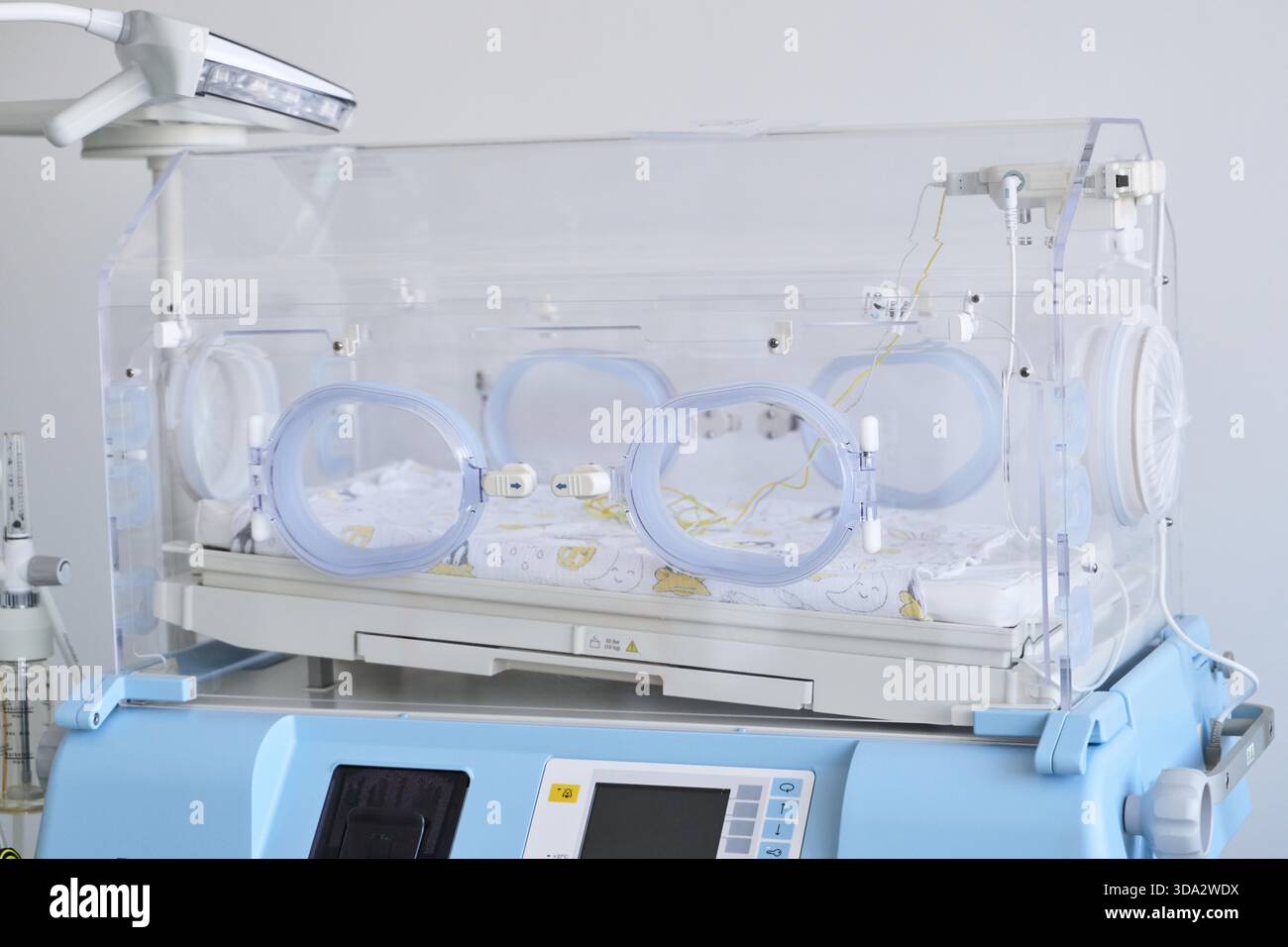 A high-tech incubator designed for the care of newborns sits in a ...
