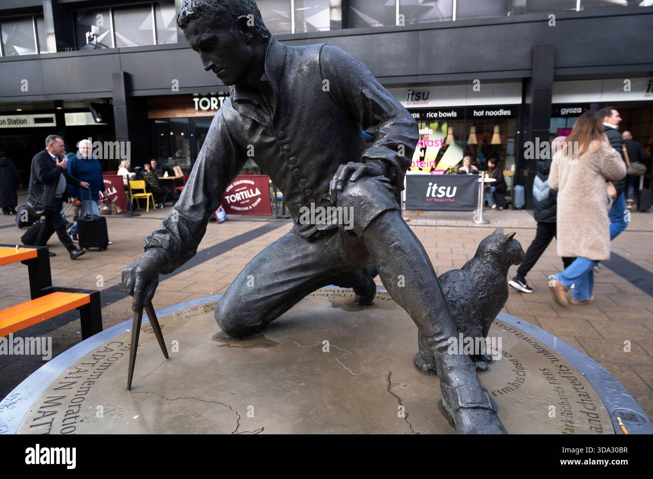 Euston Station forecourt, London. Statue of cartographer Matthew ...