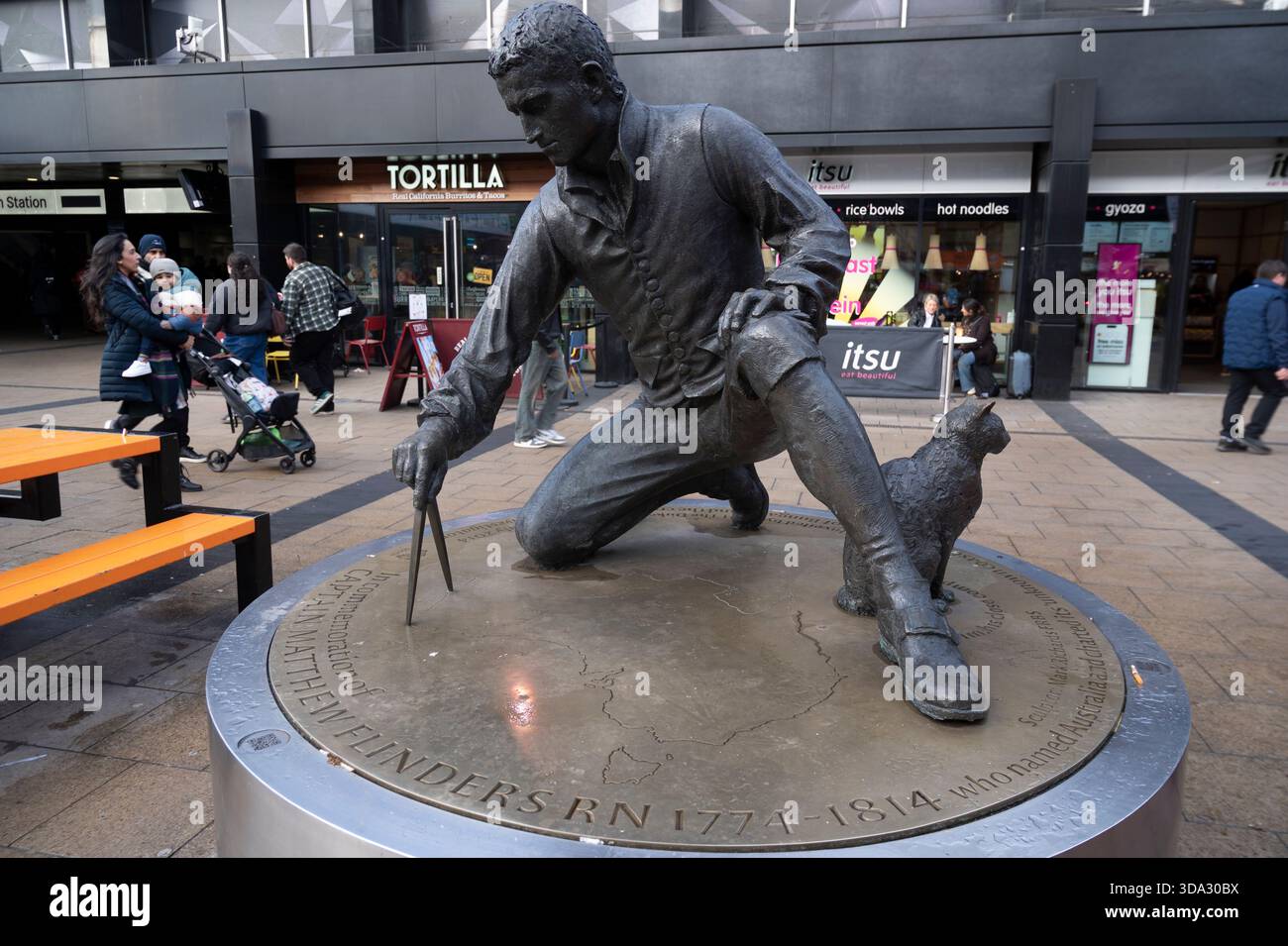Euston Station forecourt, London. Statue of cartographer Matthew ...
