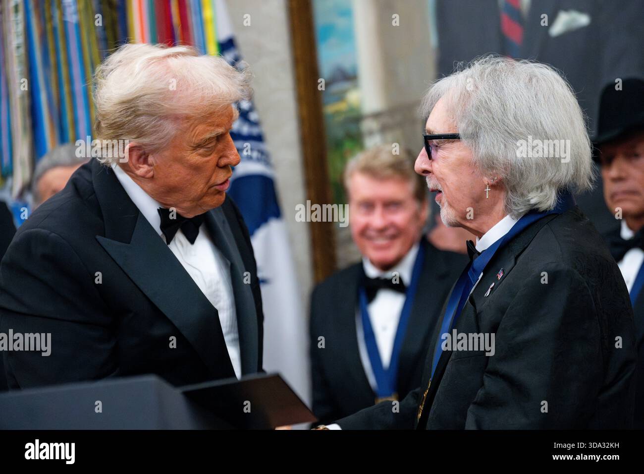United States President Donald J Trump presents a medal to 2025 Kennedy ...
