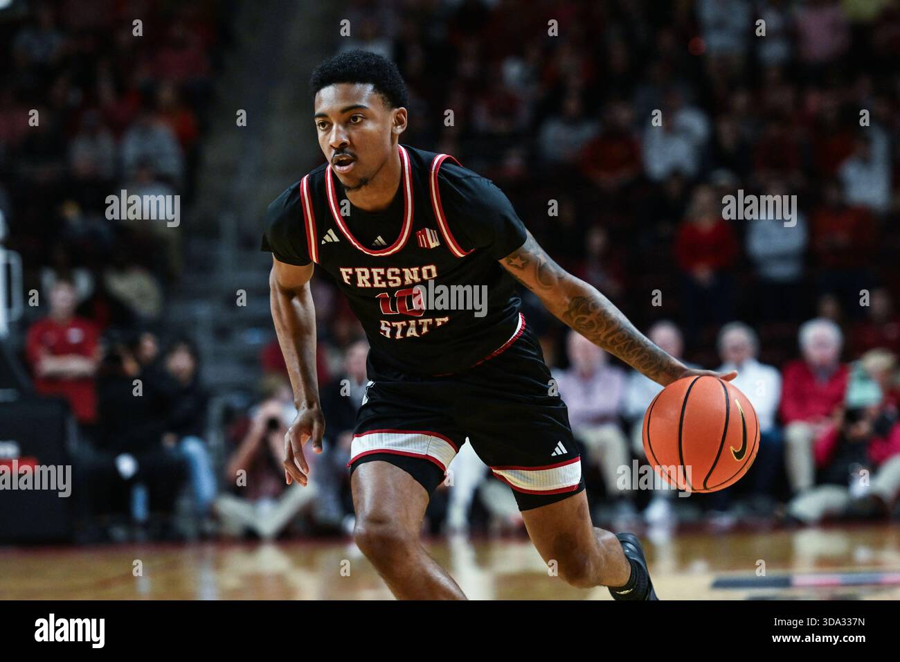 Fresno State guard Zaon Collins (10) runs a play against Arkansas ...