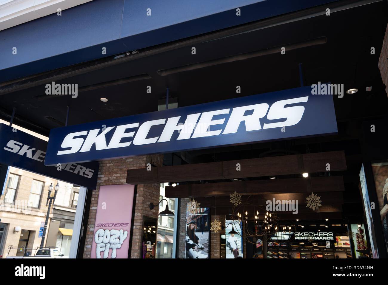 Exterior storefront and illuminated logo sign for Skechers shoe store ...
