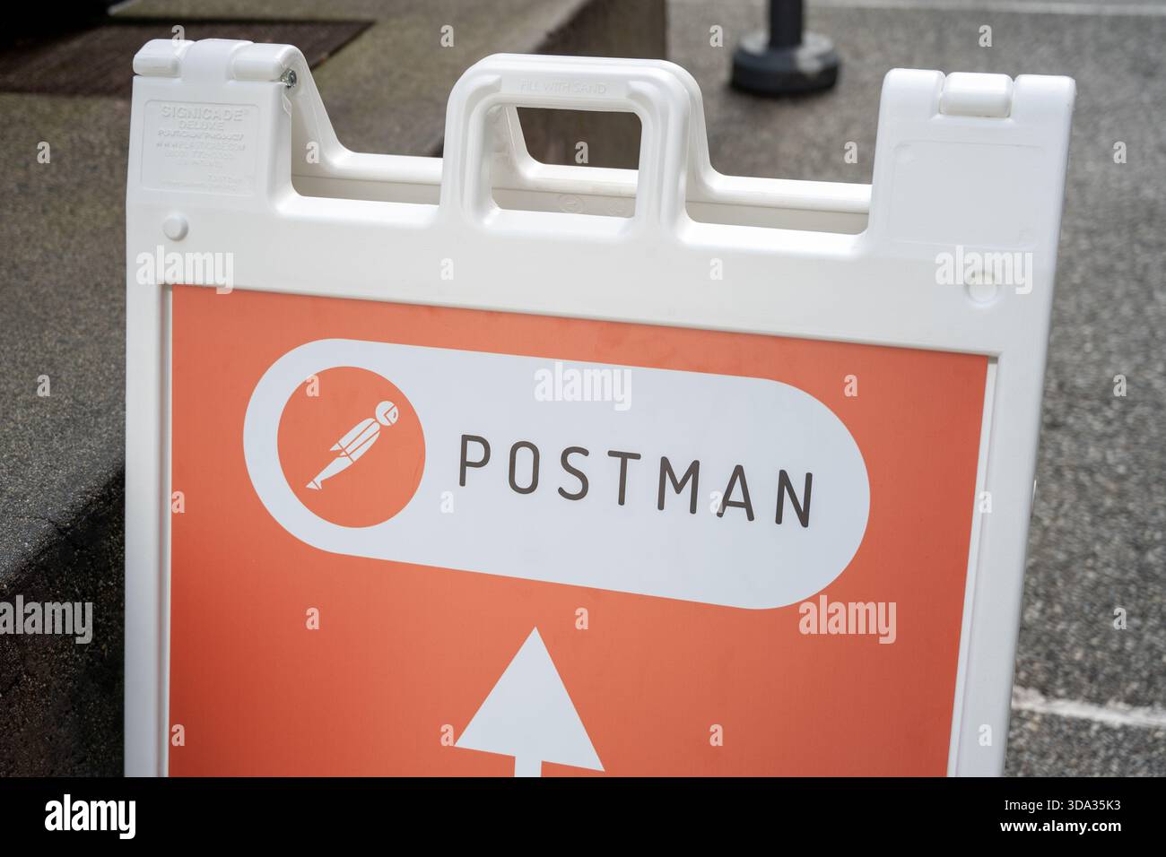 Close-up of logo for API platform Postman on direction sign in San ...