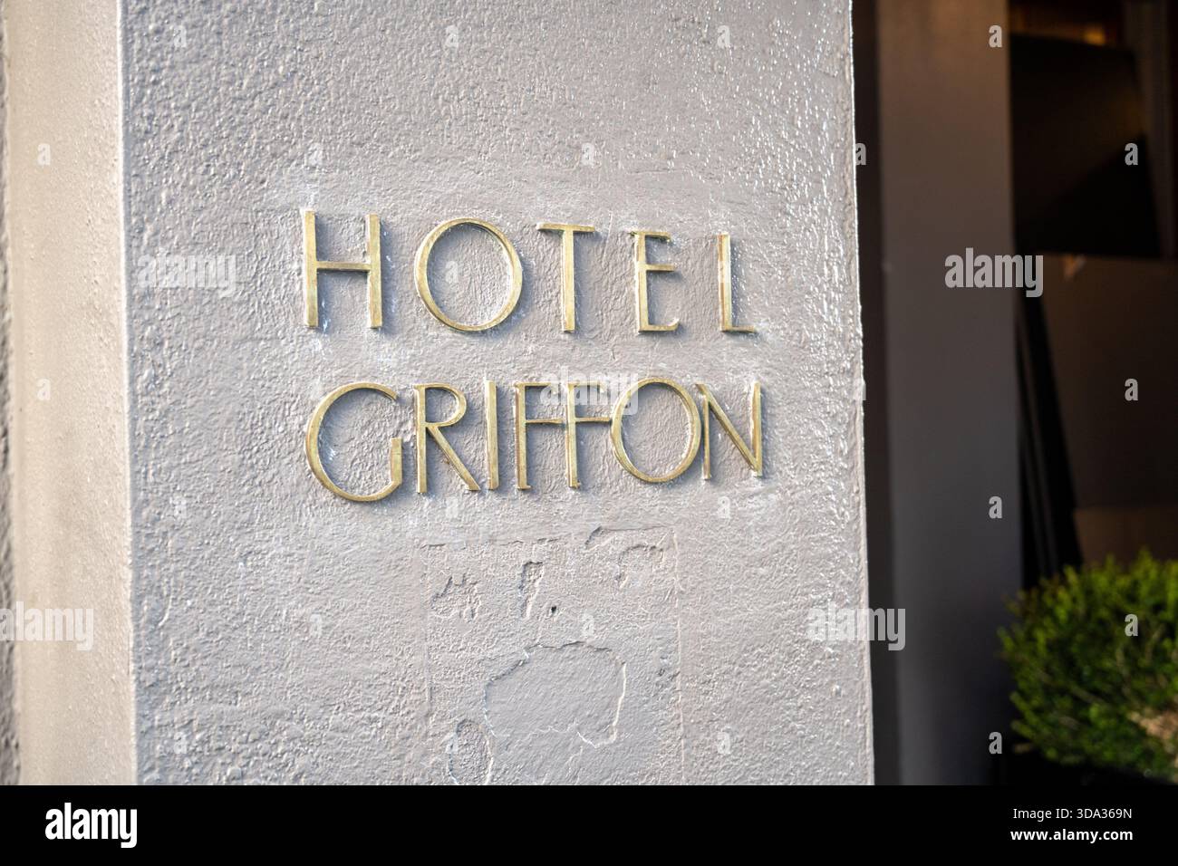 Close-up of Hotel Griffon exterior wall with gold letter signage, San ...