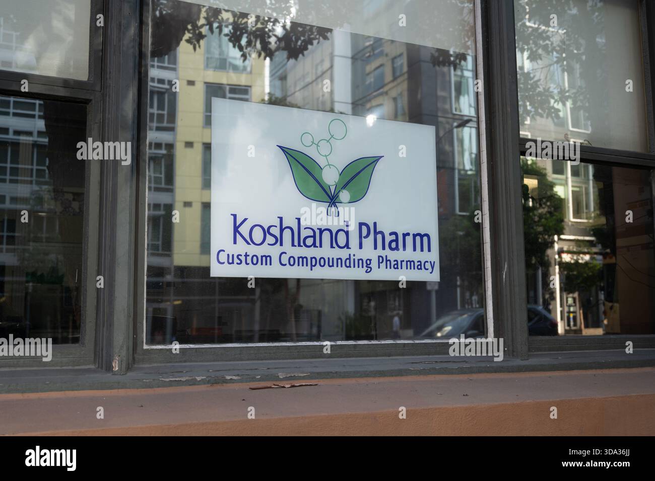 Storefront window with Koshland Pharm Custom Compounding Pharmacy sign ...