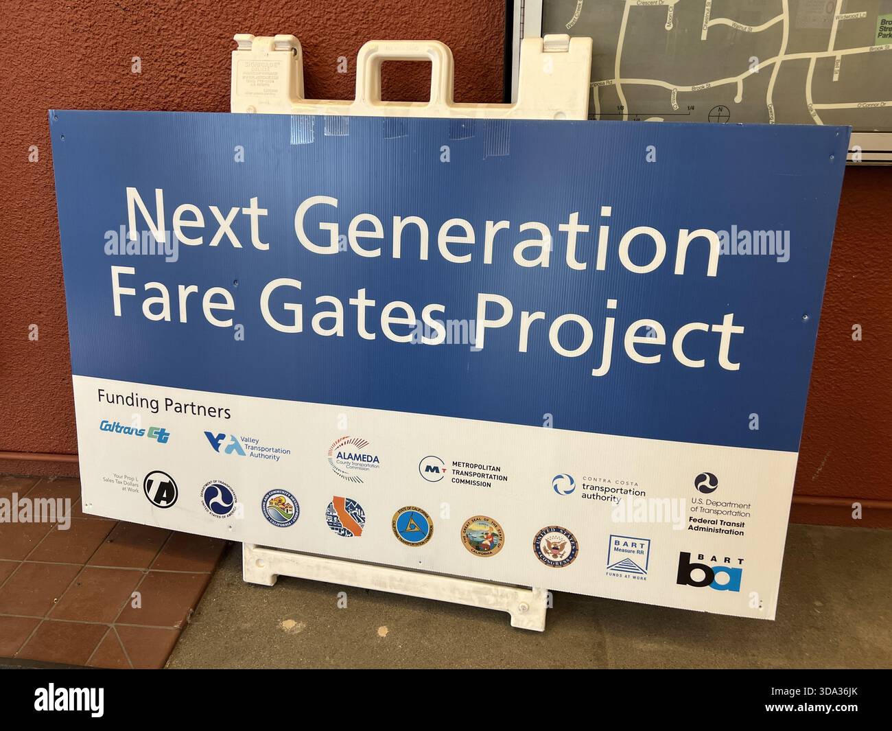 Sign for the 'Next Generation Fare Gates Project' featuring multiple ...